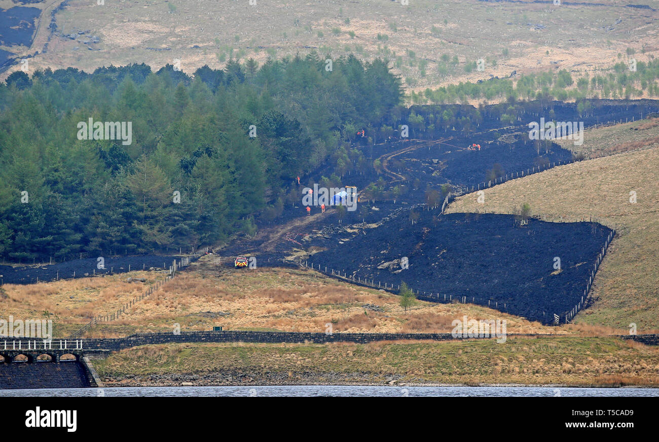 Firefighters work to control the moorland fires near Delph, Greater ...
