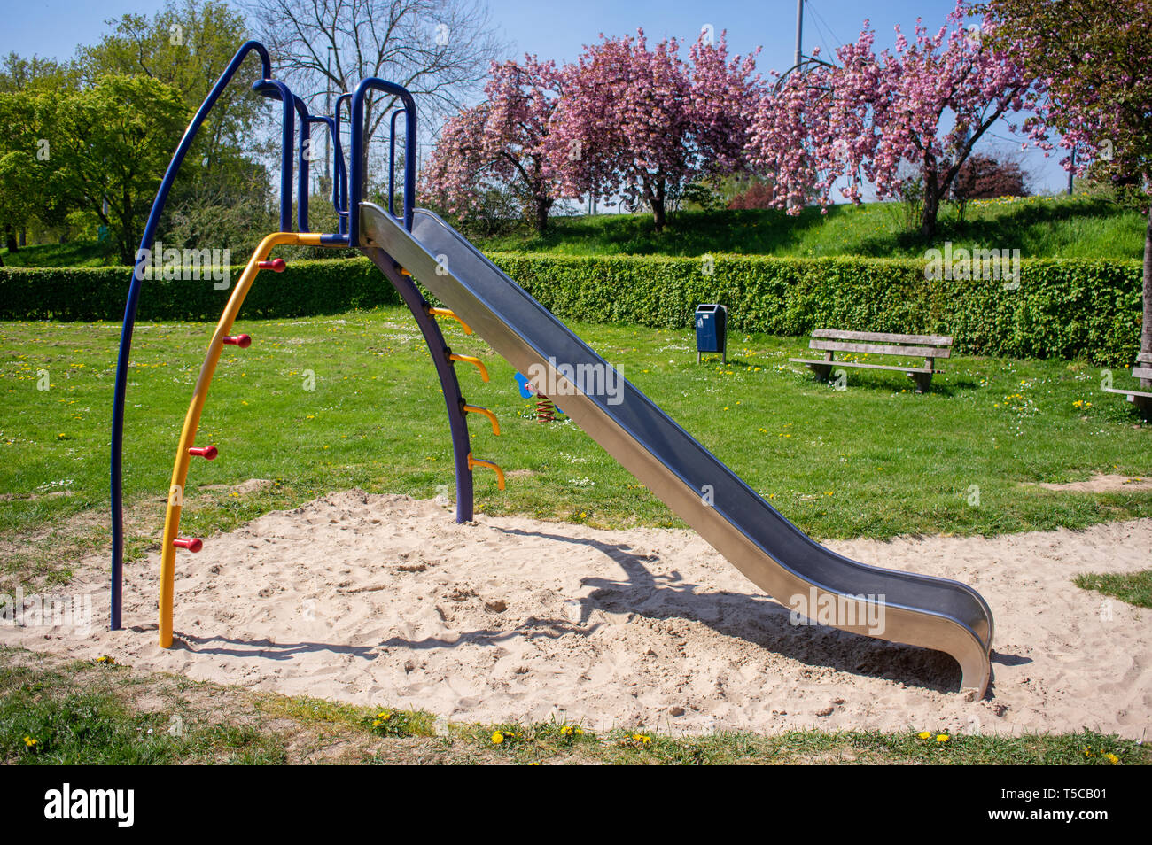 Slide in playground for children in a public park Stock Photo - Alamy