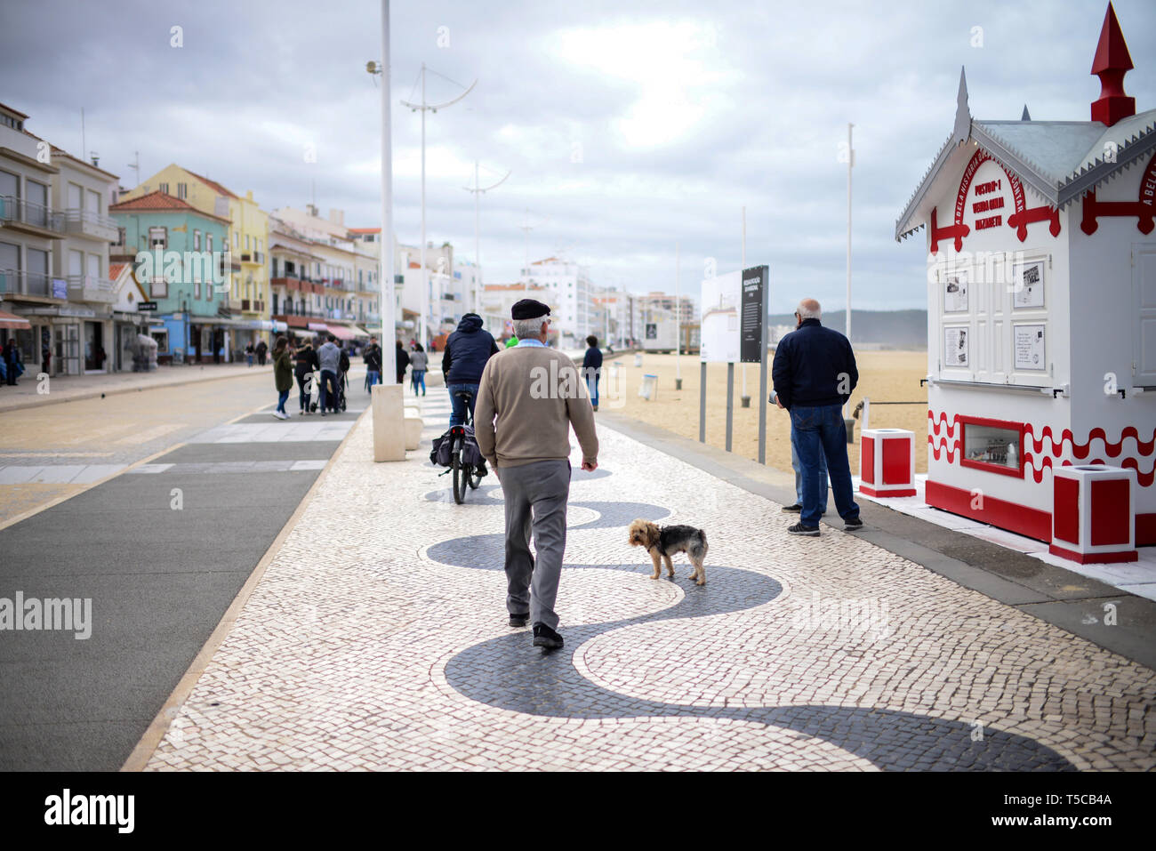 People on the beach walk of Nazare, Portugal Stock Photo - Alamy