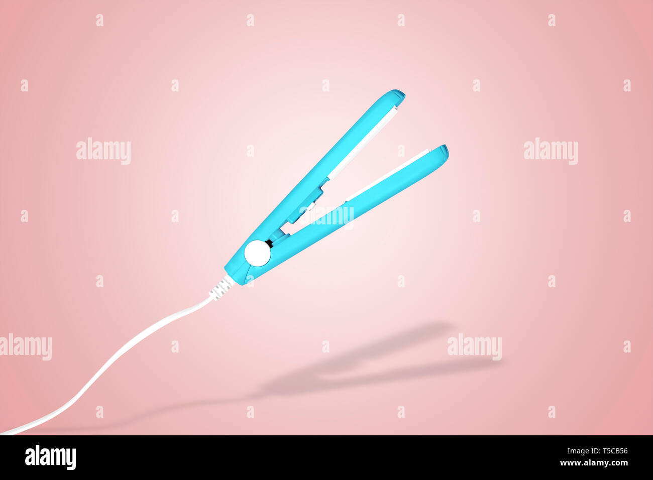 levitating hair curling iron over pink background Stock Photo - Alamy