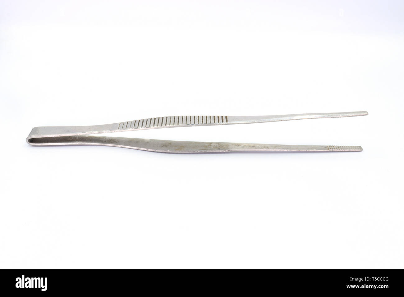 Closeup of dirty medical pincette isolated on white background. High ...