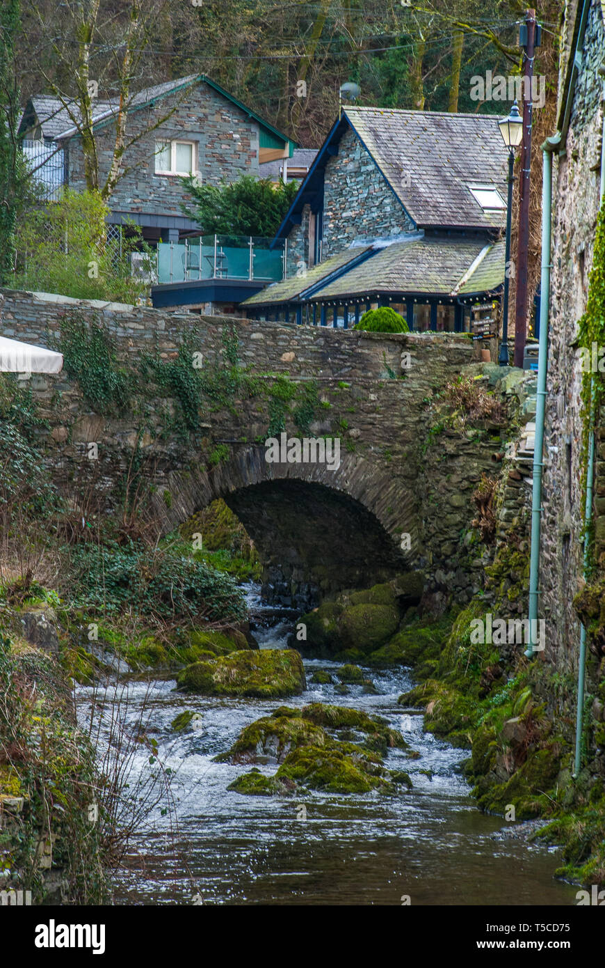 Small stone bridge on river. waterfall under the bridge Stock Photo - Alamy