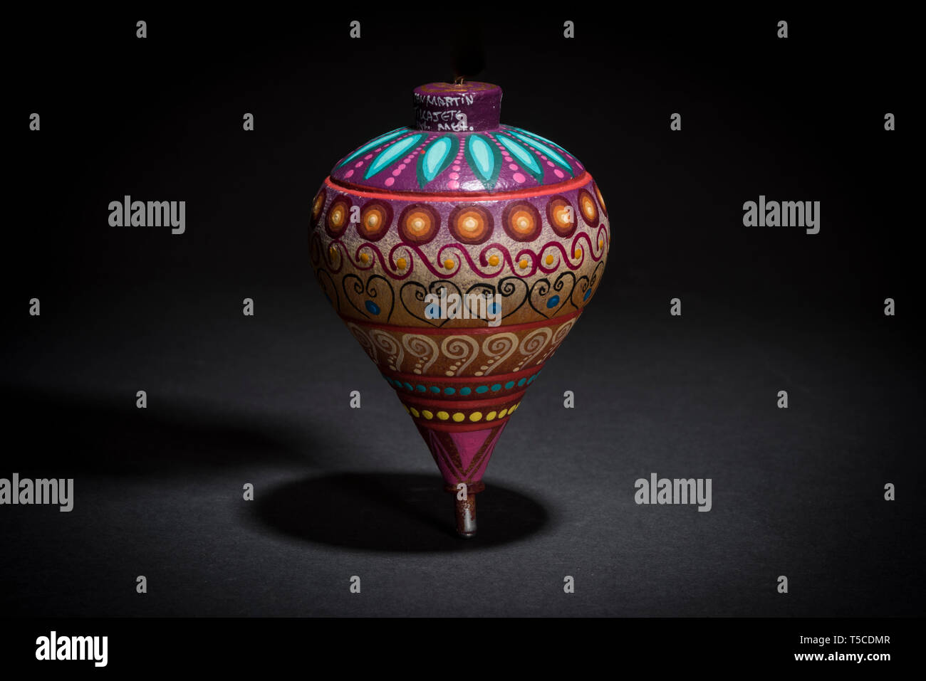 Colorful handmade wooden spinn Stock Photo - Alamy