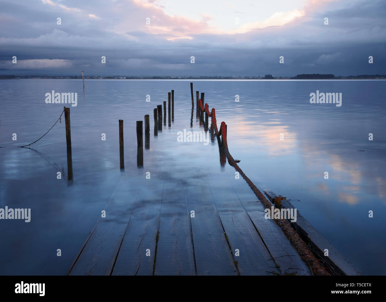 Man standing jetty looking lake hi-res stock photography and images - Alamy