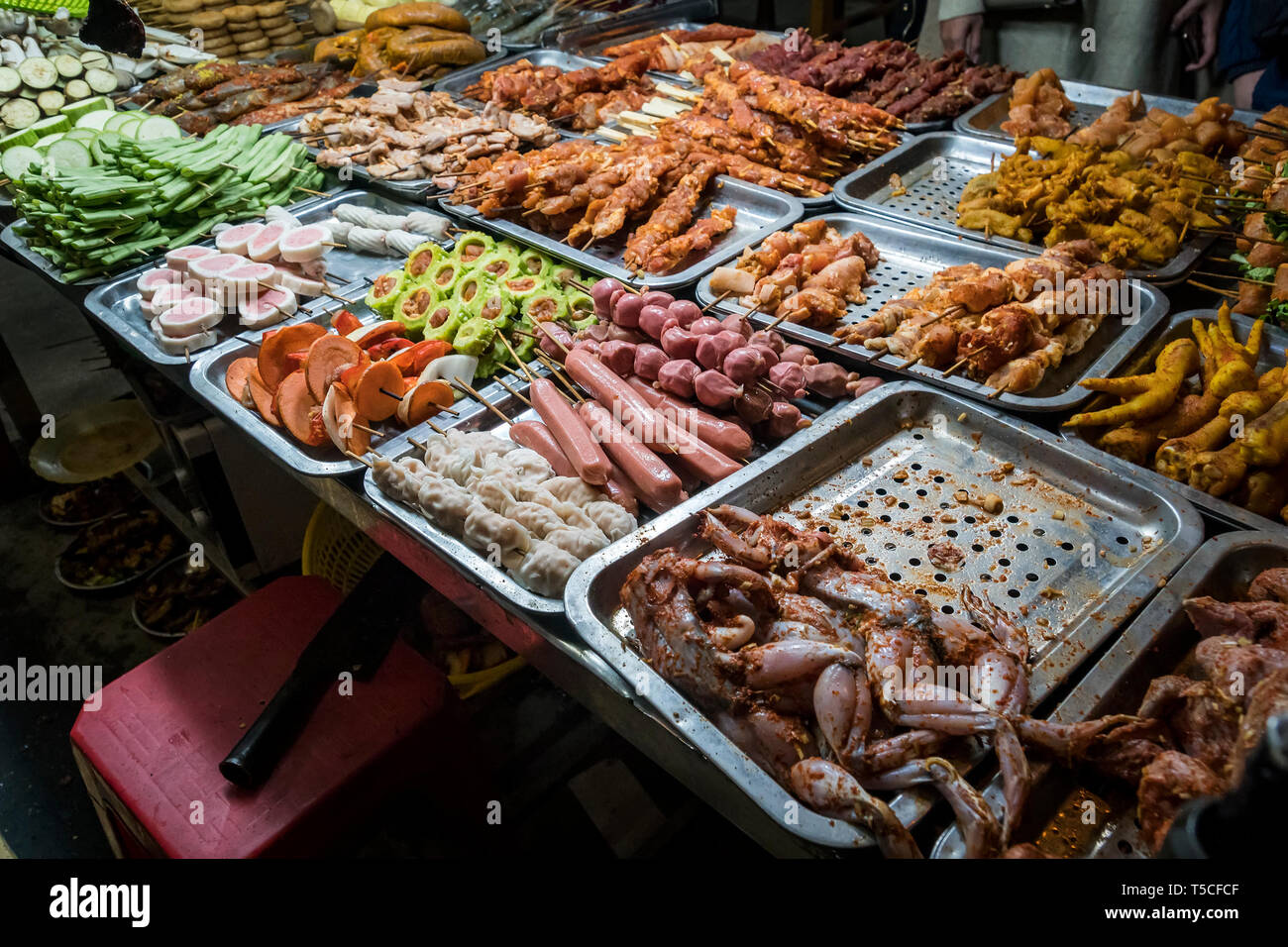 Asian food in Hanoi in Vietnam. Street market with Vietnamese cousine ...