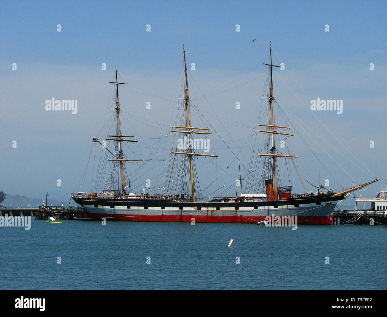 A three mast wood sailing ship is docked in San Francisco Bay Stock ...