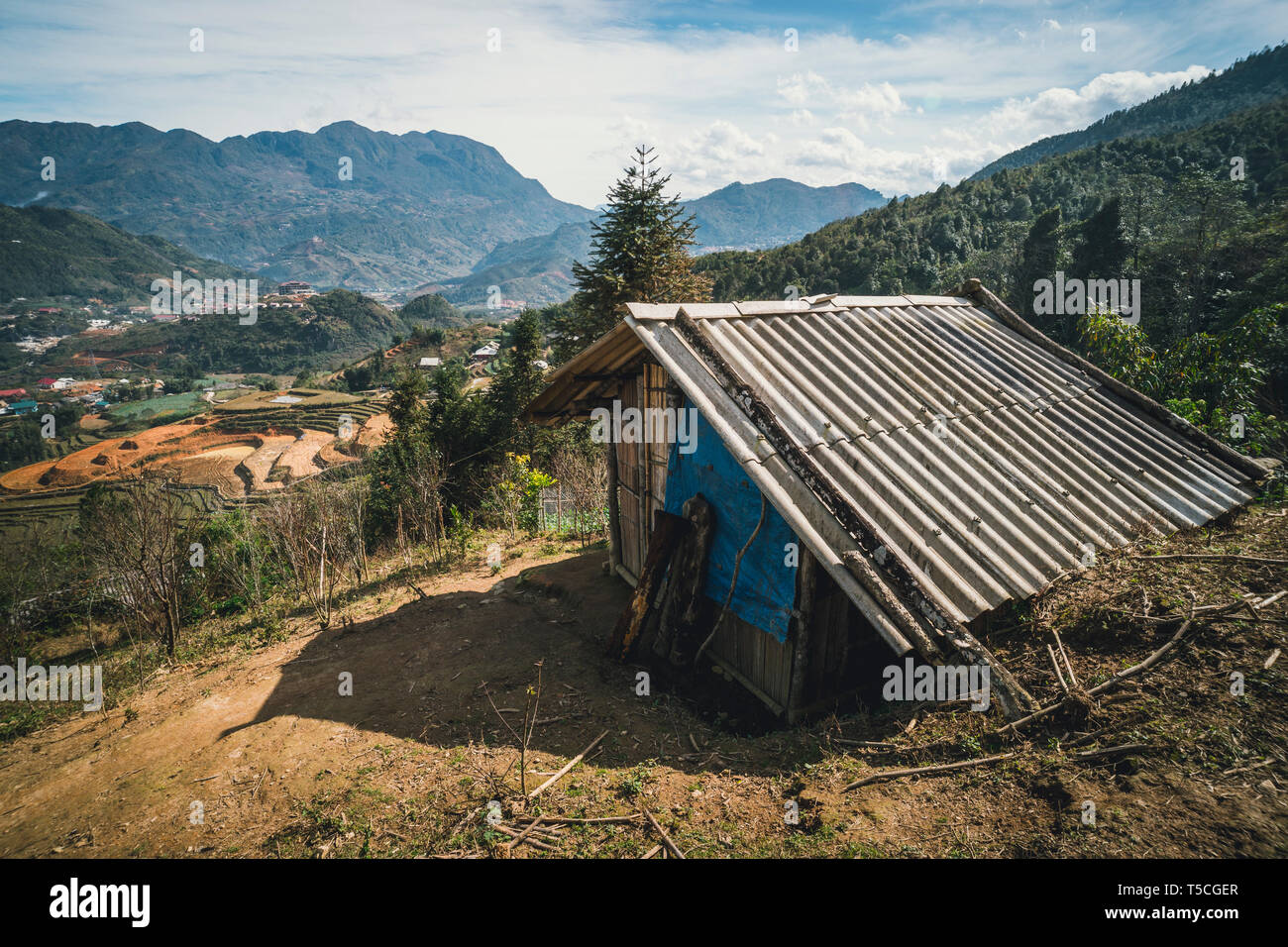Landscape with a hut in the paddy rice terraces. Poor old dwelling in ...