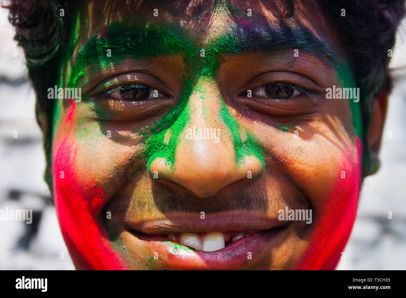 Portrait Of A Man With Colour On His Face On Festival Of Holi Stock ...