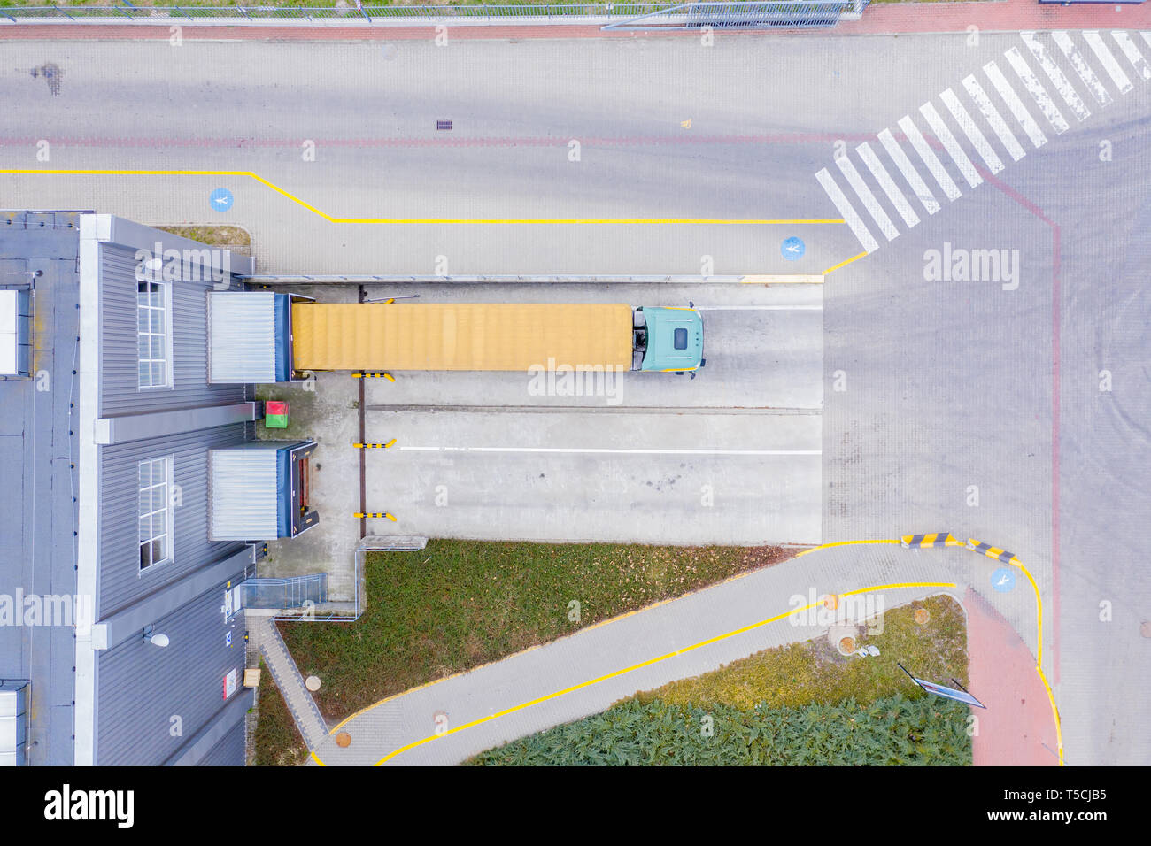 Aerial Side Shot of Industrial Warehouse Loading Dock where Man Stock ...