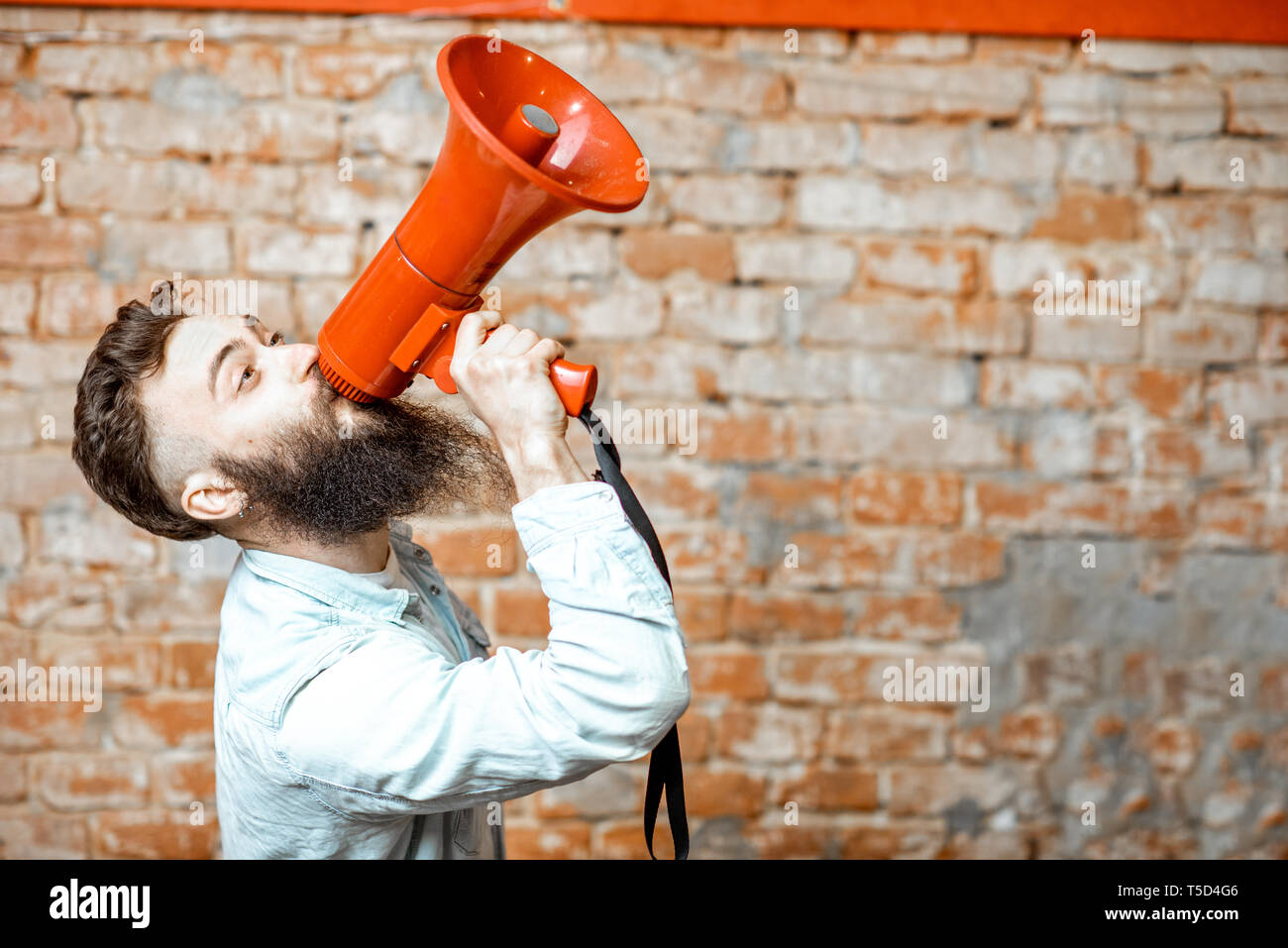 Person speaking bullhorn hi-res stock photography and images - Alamy