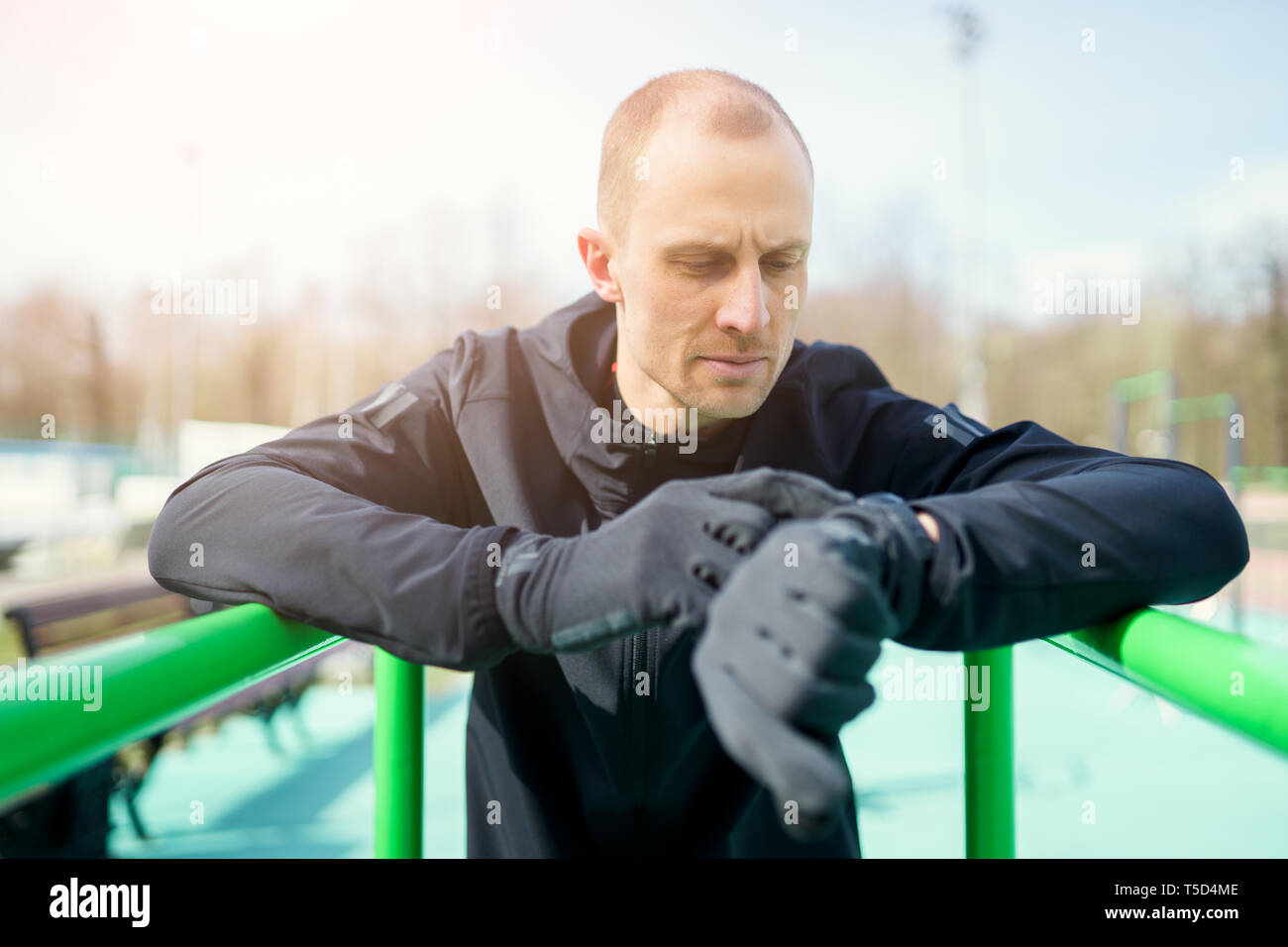 Guy flexing his muscle while looking hi-res stock photography and ...