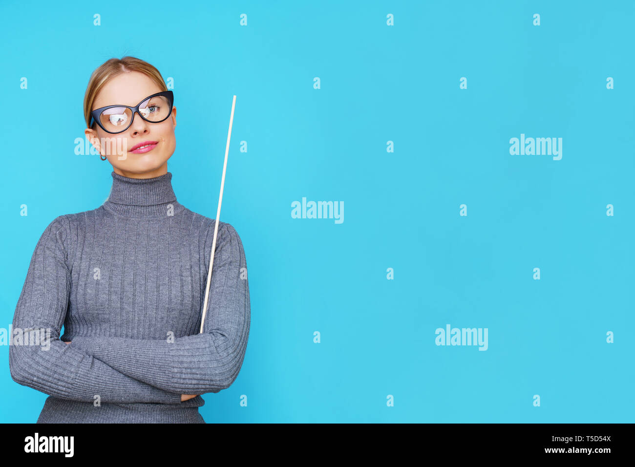 Photo of woman teacher with pointer on empty blue background Stock ...
