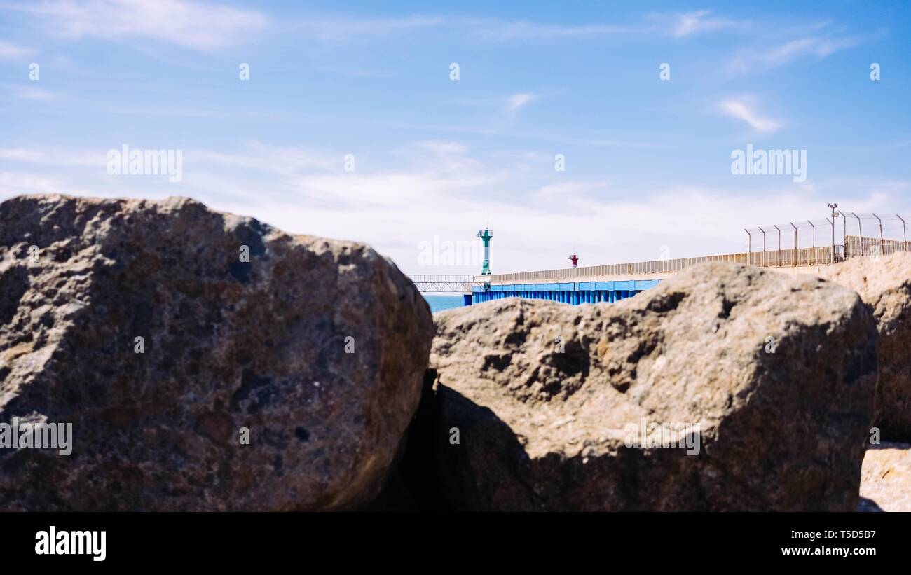 Sea coast with a beacon Stock Photo - Alamy