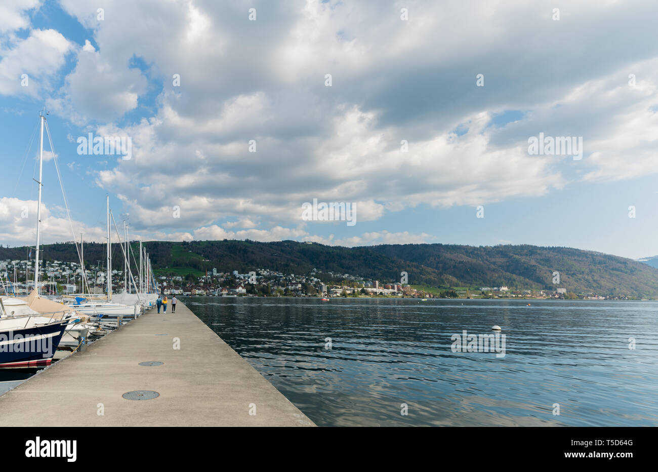 Zug, ZG / Switzerland - 20 April, 2019: people walk to their boat on ...