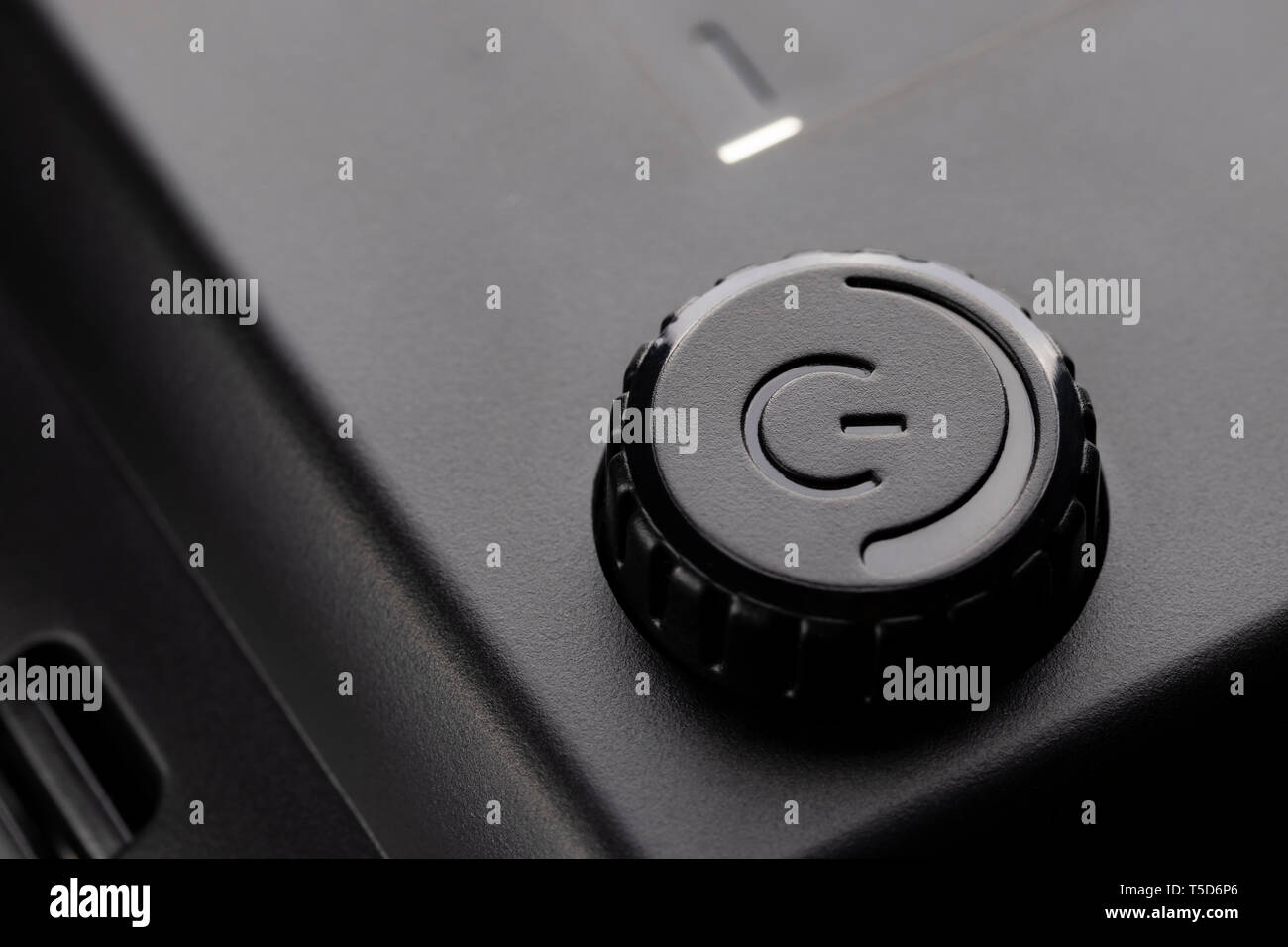 Black plastic power on off button with power adjustment. The concept of ...