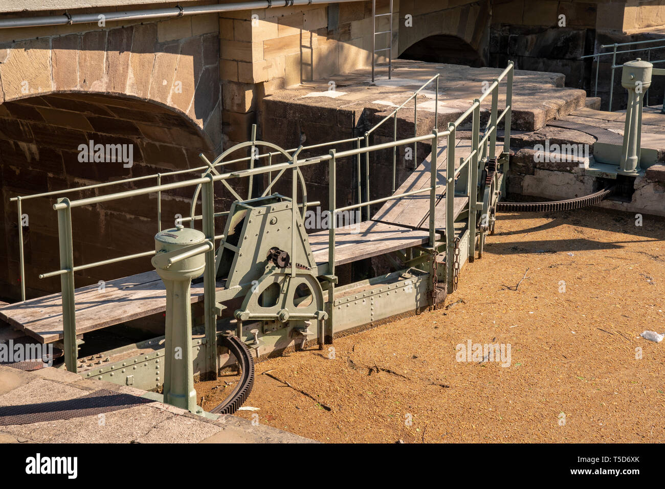 Lock with bridge and wheel with washed up pollen Stock Photo - Alamy