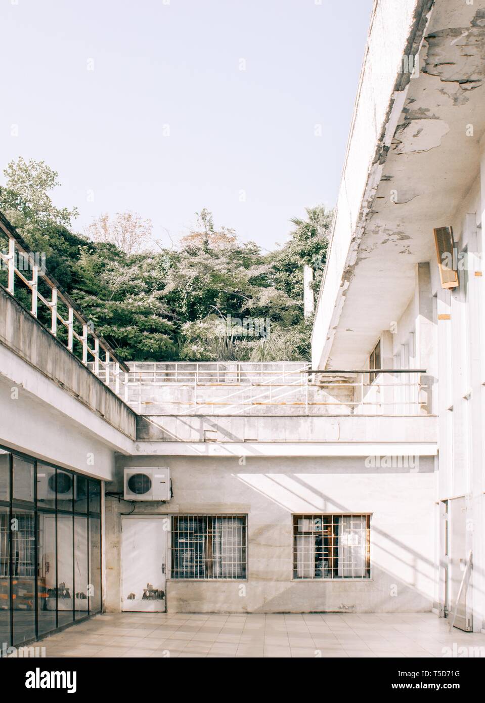 Rusty old white building Stock Photo - Alamy