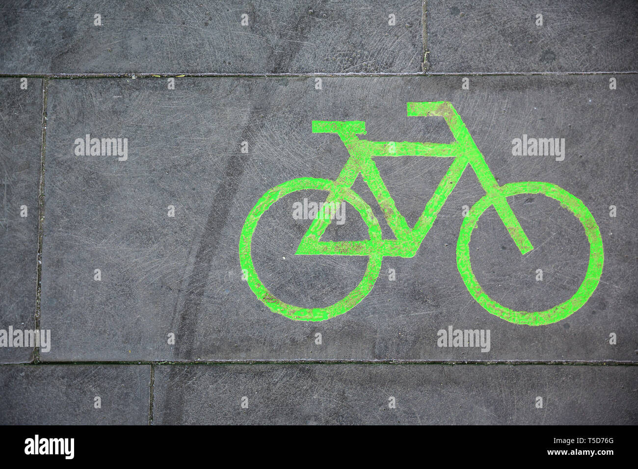 Photo of bicycle green sign on ground for graphic and web design, for ...
