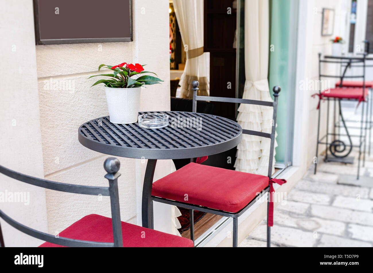 Tables in the restaurant in the open air Stock Photo - Alamy