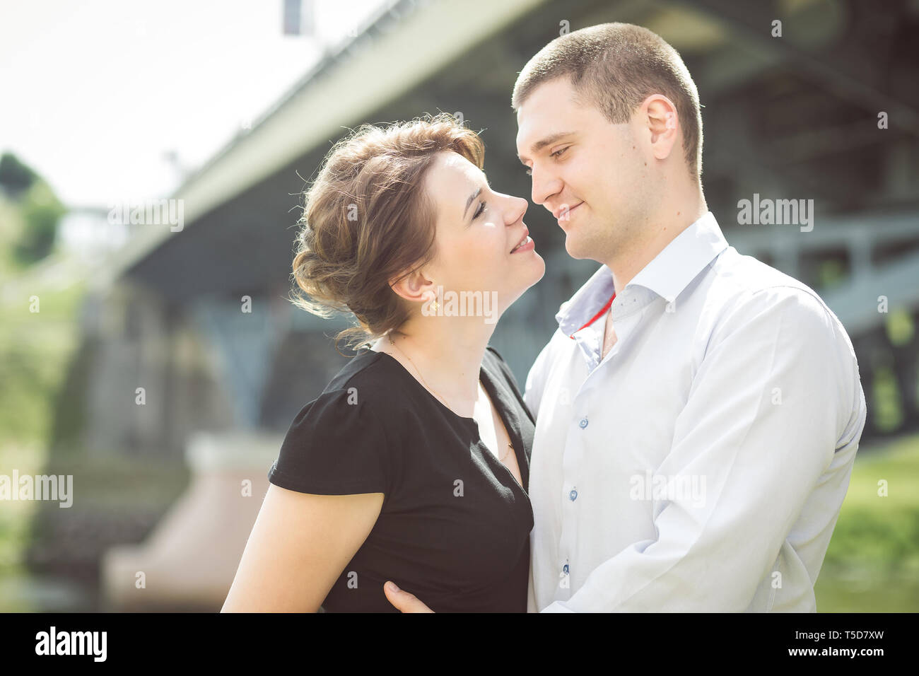 Portrait of two beautiful young lovers in the park Stock Photo - Alamy