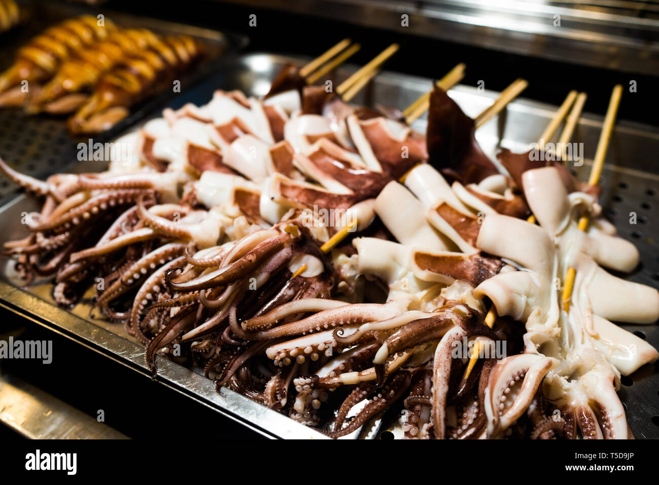 Squid eating hi-res stock photography and images - Alamy