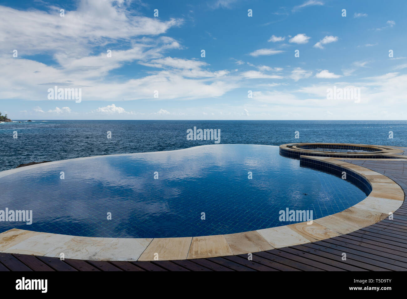 Swimming pool resort surface on Seychelles coast Stock Photo - Alamy