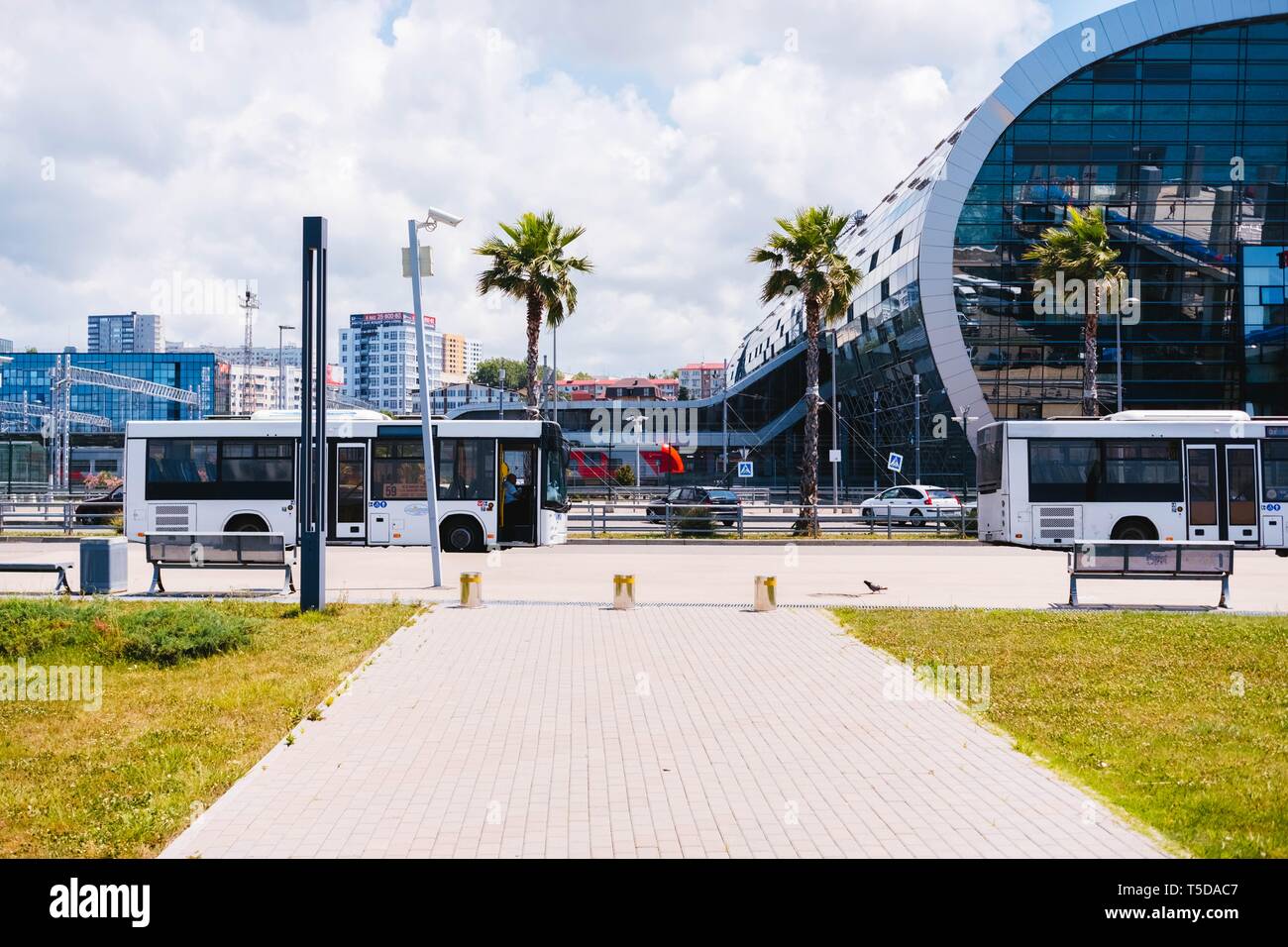 Bus station of a beautiful city with palm trees Stock Photo - Alamy