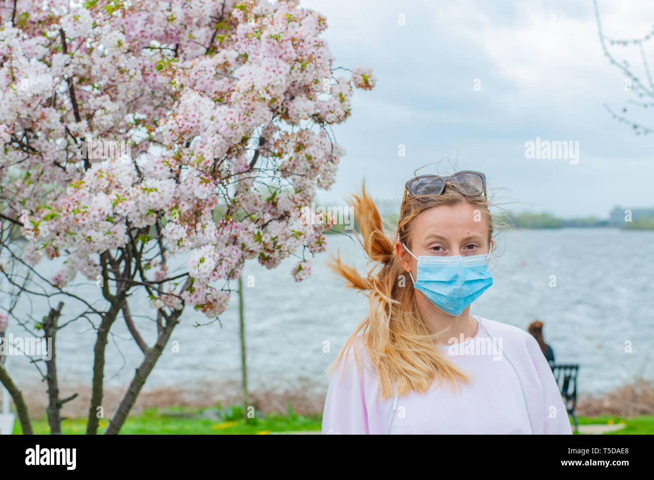 Spring Allergy. Young woman in protective mask from pollen allergy ...