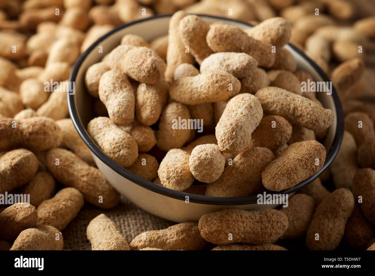 Peanuts with shell on a table Stock Photo - Alamy