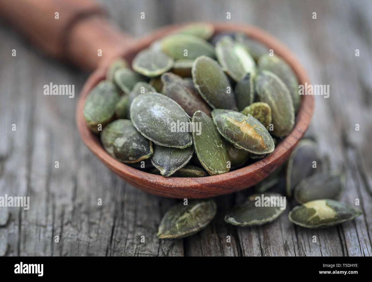 Roasted salty pumpkin seeds hi-res stock photography and images - Alamy