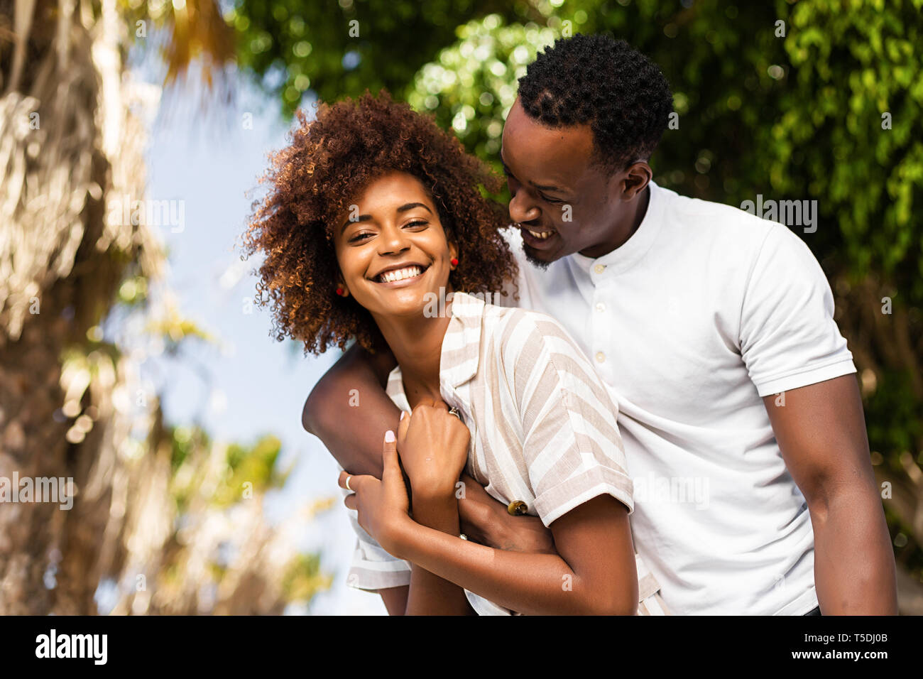 Outdoor protrait of black african american couple embracing each other ...