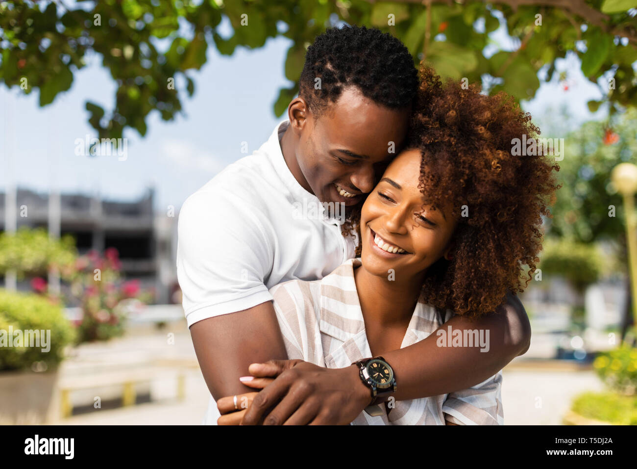 Outdoor protrait of black african american couple embracing each other ...