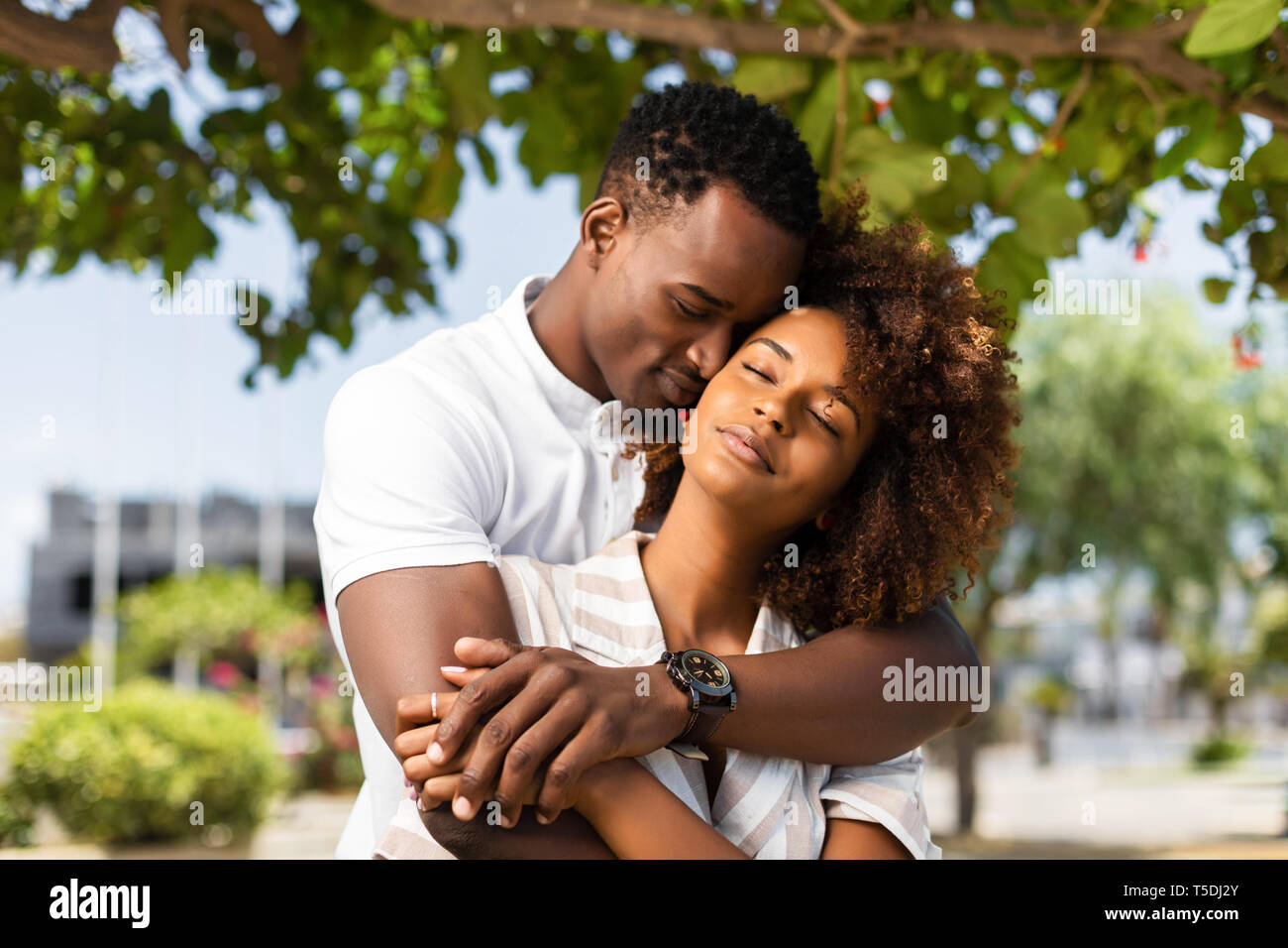 Outdoor protrait of black african american couple embracing each other ...