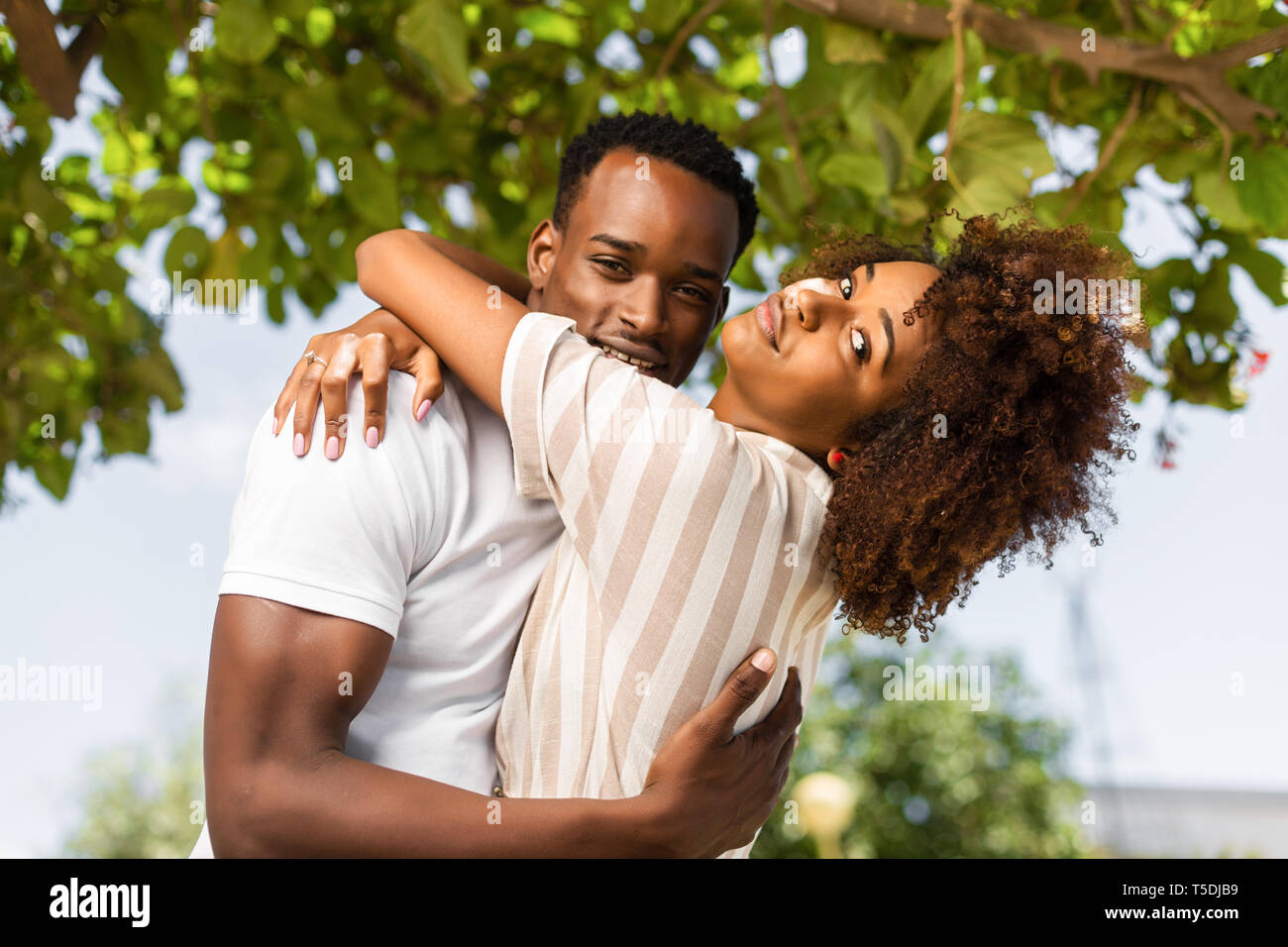 Outdoor protrait of black african american couple embracing each other ...