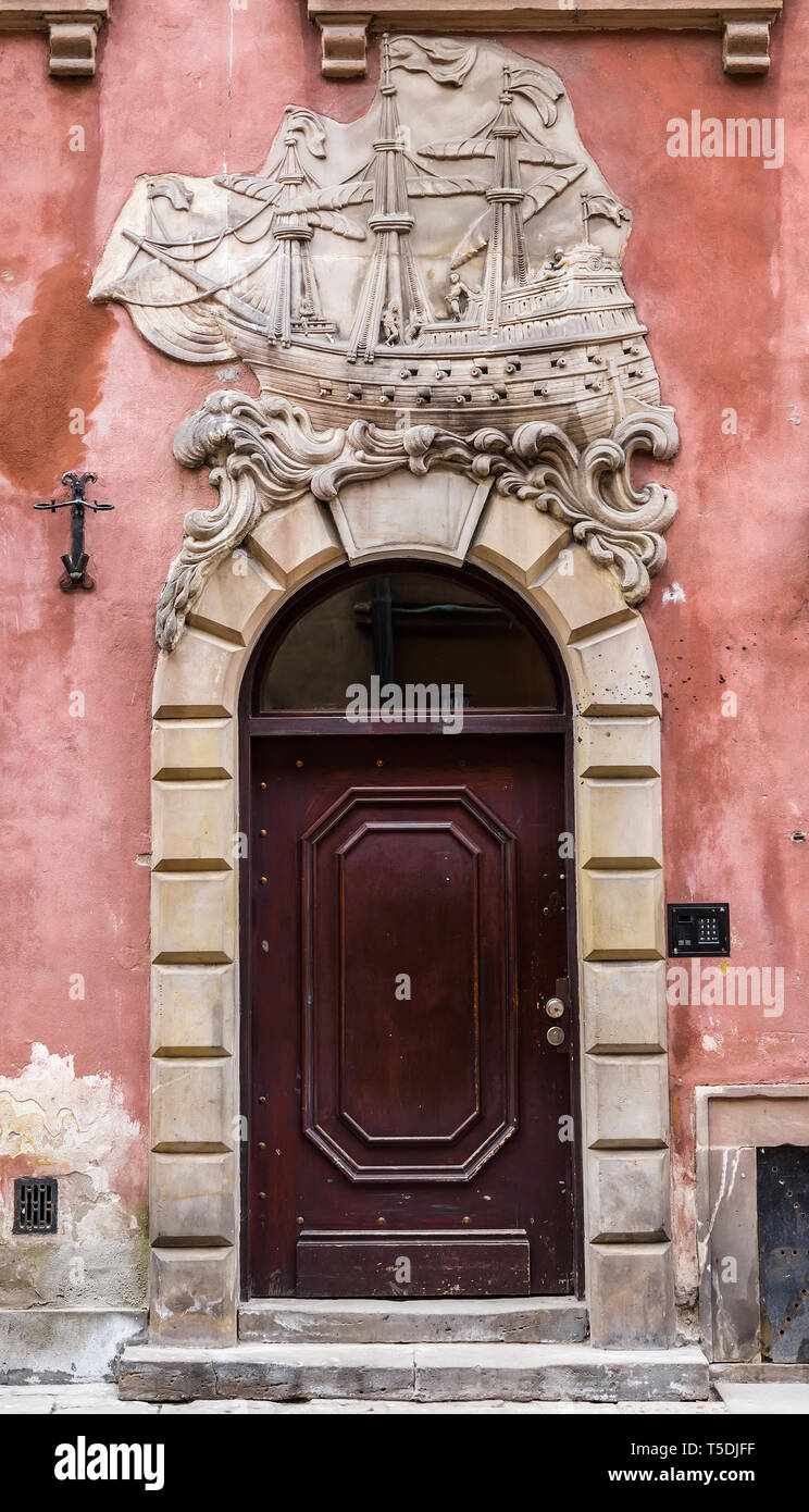 Wooden door with the beautiful stucco above. Warsaw. Poland Stock Photo ...
