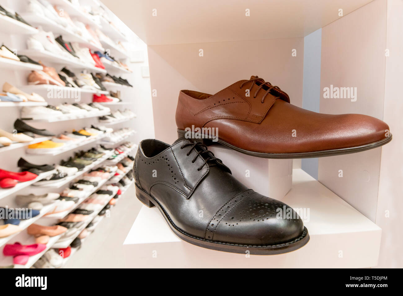 Elegant man shoes on store display Stock Photo - Alamy