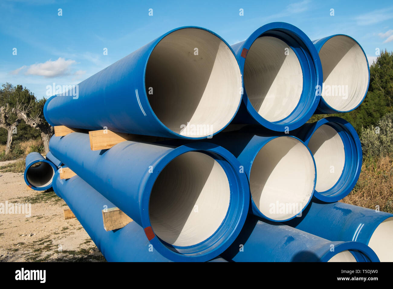 Stacked natural gas pipes waiting to be used Stock Photo - Alamy