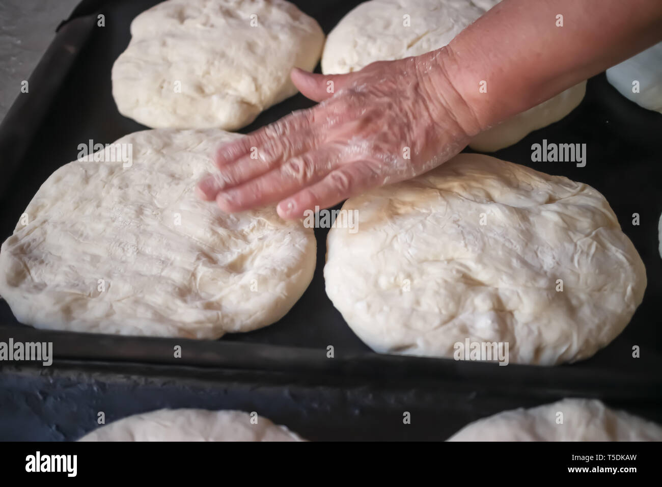 Traditional old woman making bread hi-res stock photography and images ...