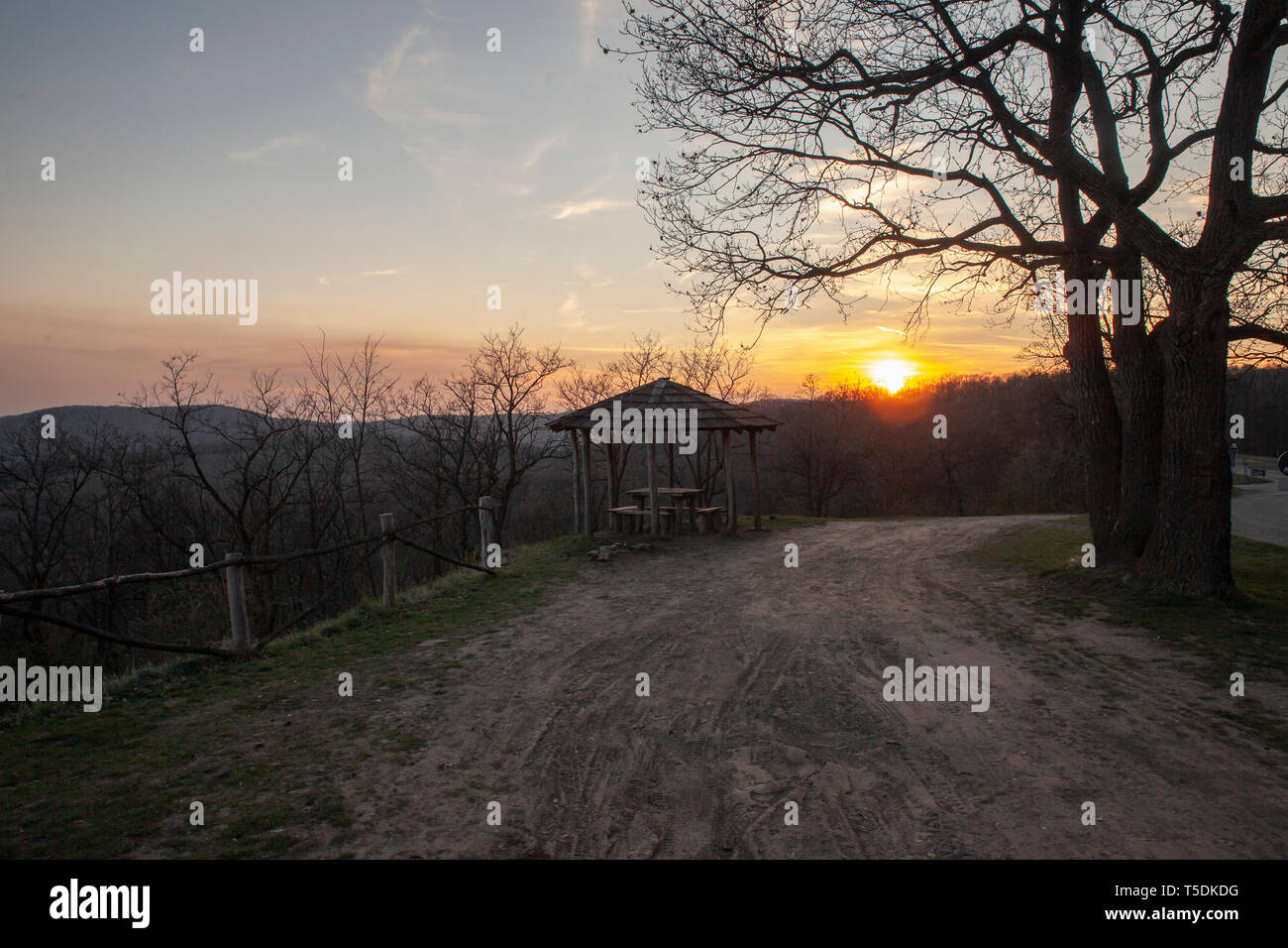 landscape sunset or sunrise shot, no people. Dirt road and mountain ...