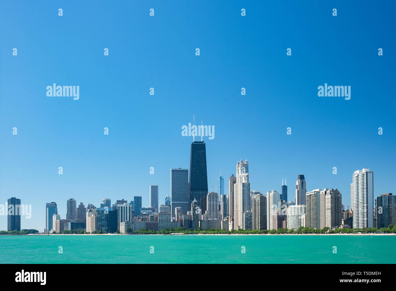 Chicago skyline in a sunny day from the shore of Lake Michigan Stock ...