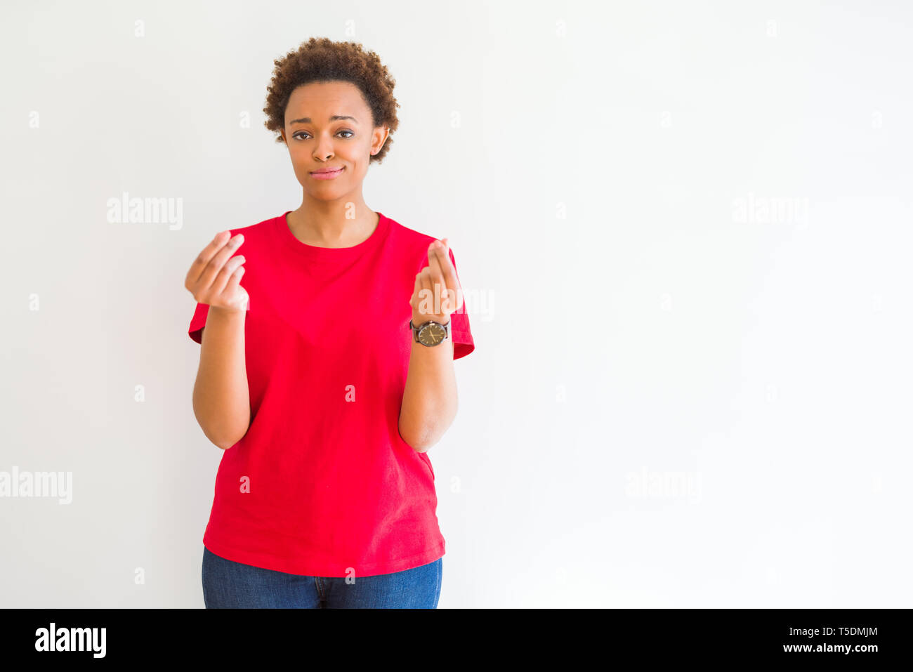 Young beautiful african american woman over white background Doing ...