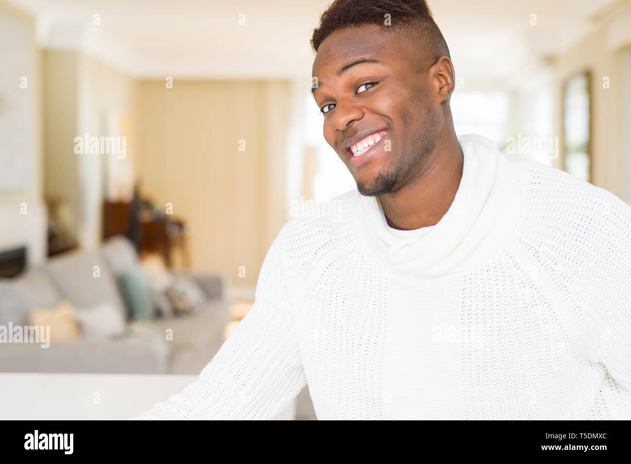 Handsome african young man smiling cheerful with a big smile on face ...