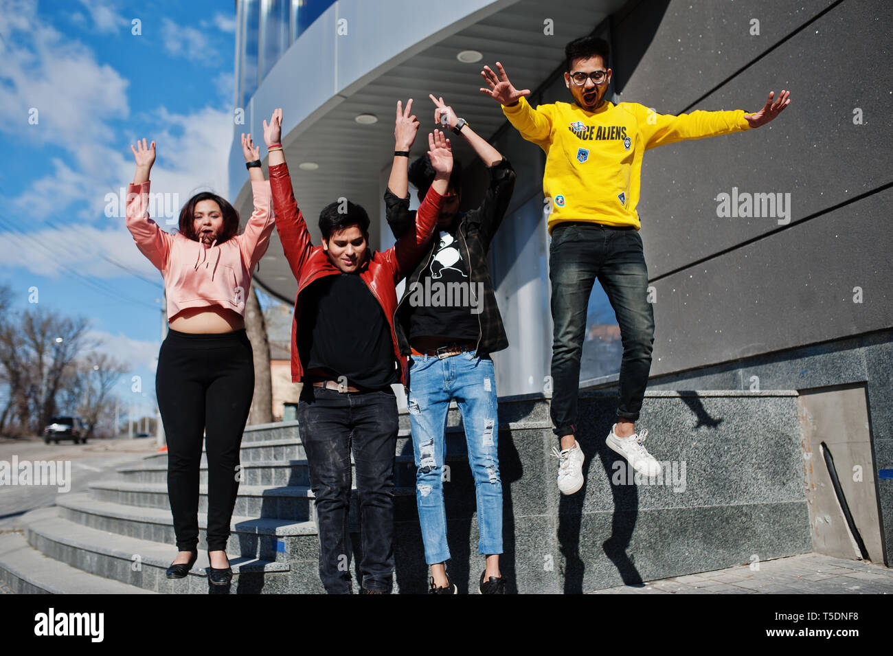 Group of asian people friends stand on stairs outdoor against modern ...