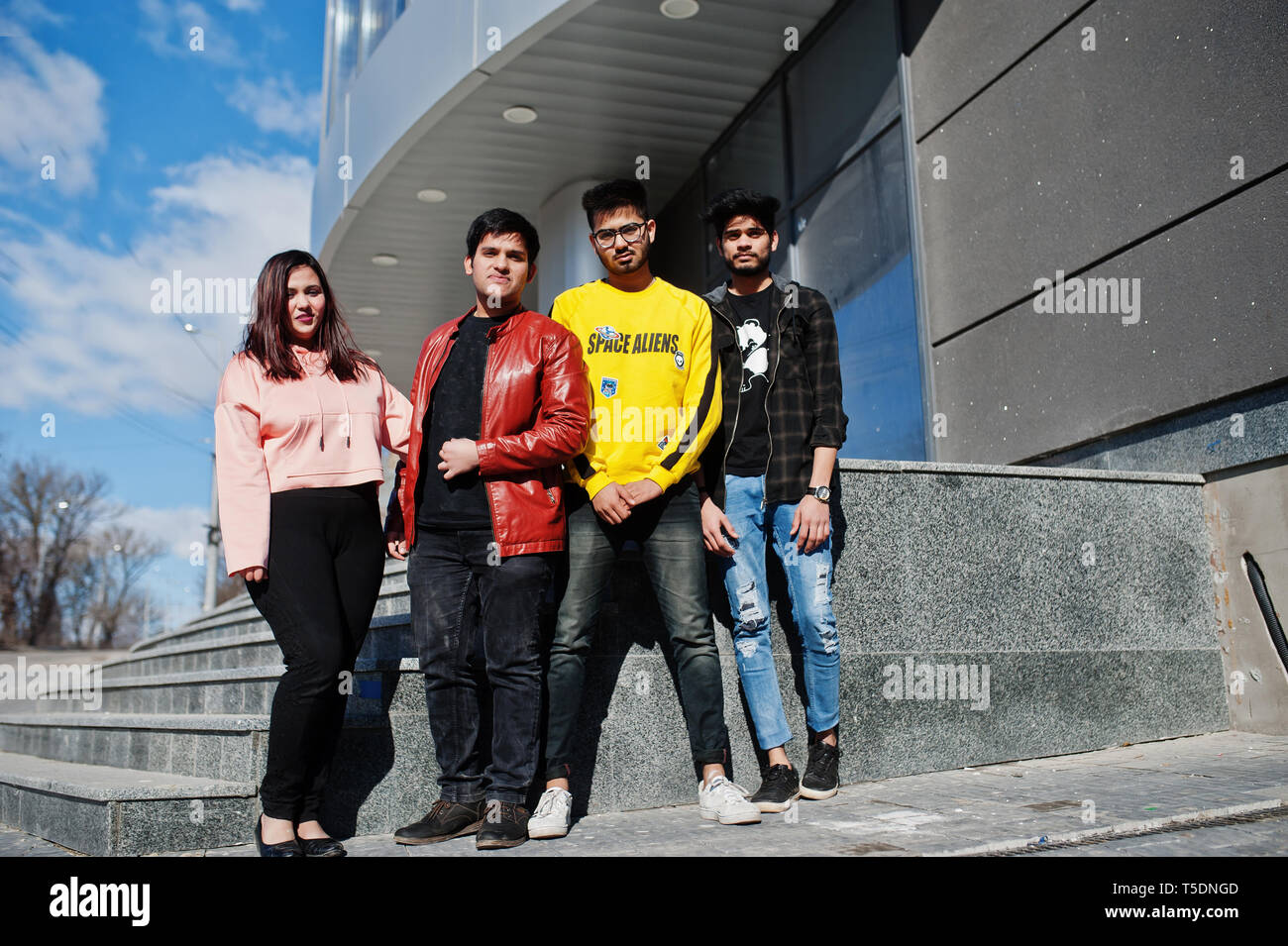 Group of asian people friends stand on stairs outdoor against modern ...