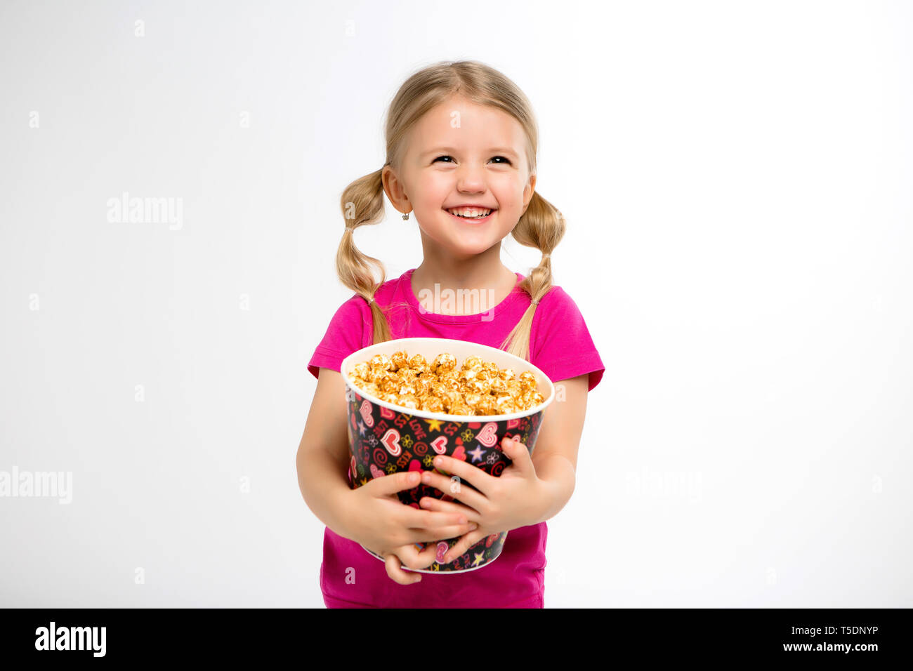 baby girl with popcorn on white isolate background.Little cute baby ...