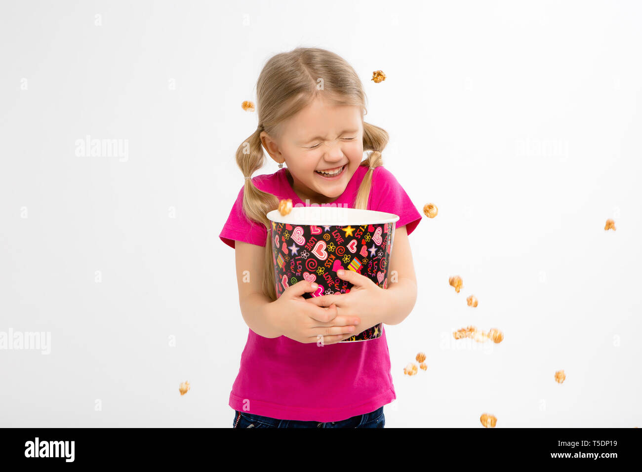 baby girl with popcorn on white isolate background.Little cute baby ...