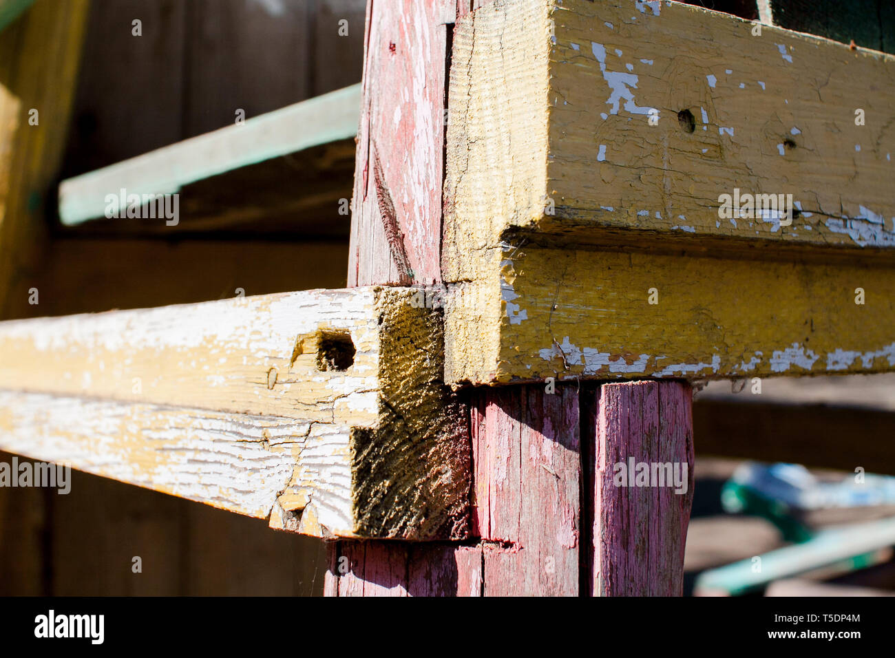 wooden structures with peeling colored paint on the playground Stock ...