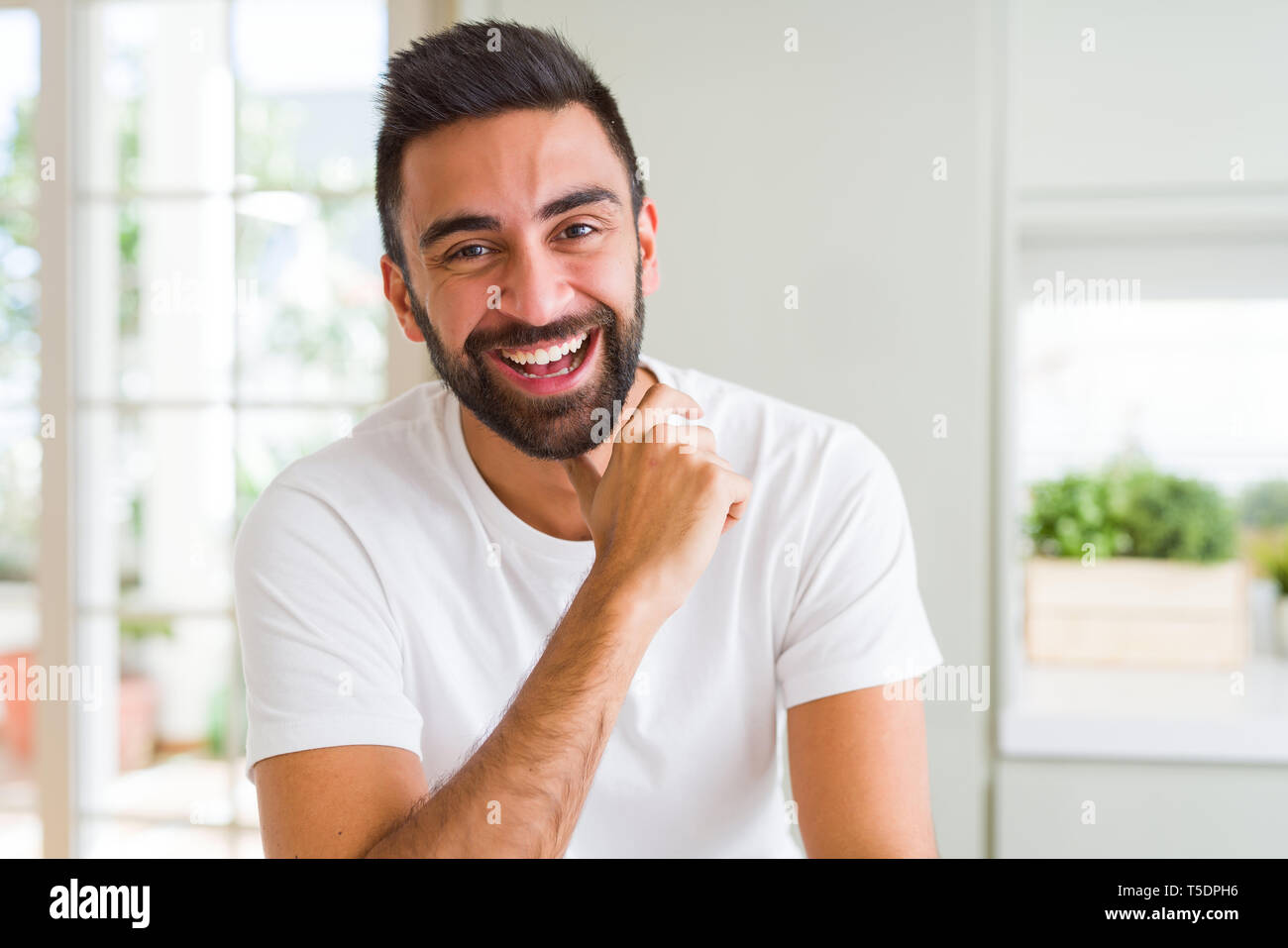Handsome man smiling cheerful with a big smile on face showing teeth ...
