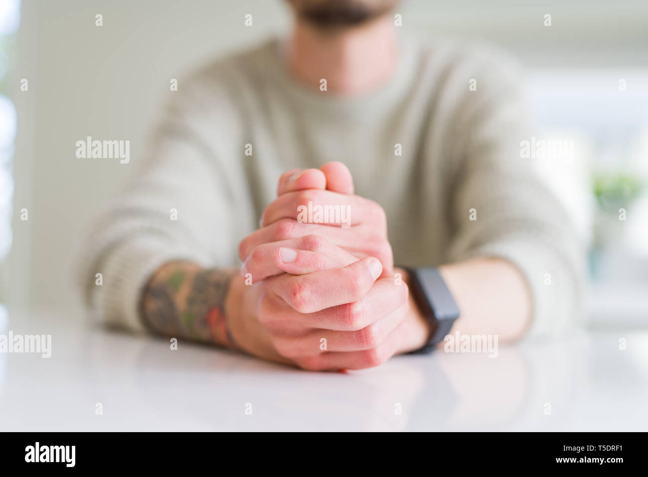 Close up of man hands over white table Stock Photo - Alamy