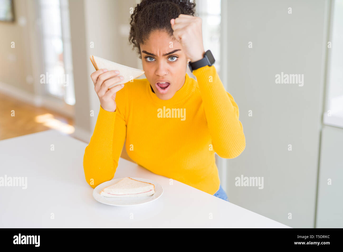 Woman eating sandwich stressed hi-res stock photography and images - Alamy